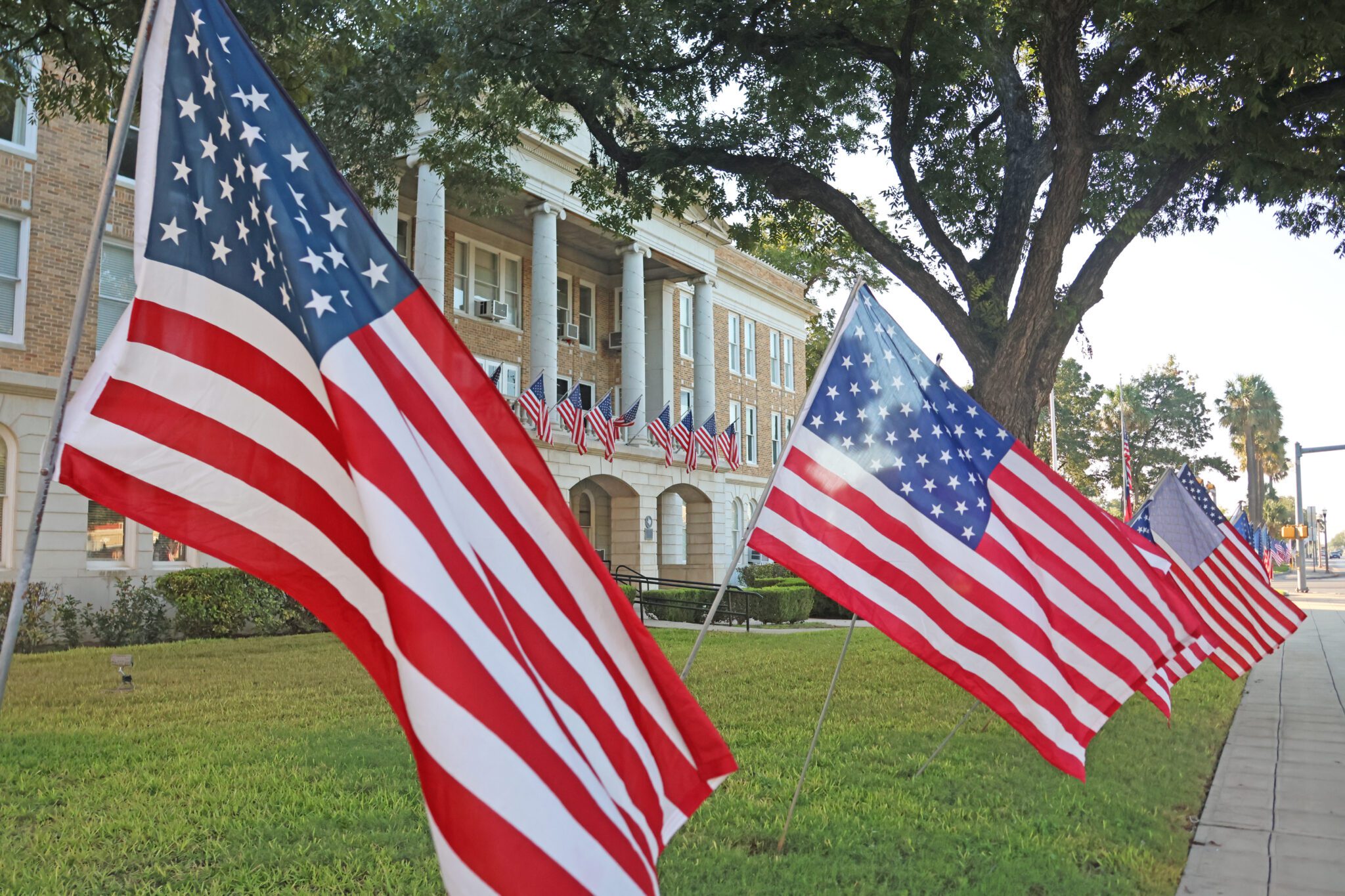 Lions Club bolsters community with flag project - Uvalde Leader News
